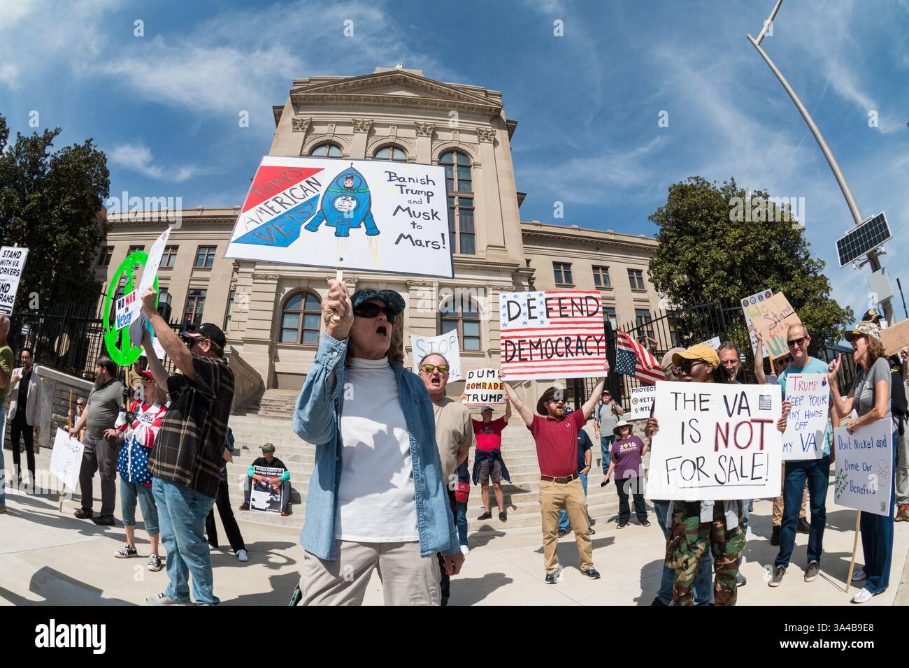 Atlanta, GA / USA - March 14, 2025: A group of veterans hold signs to ...