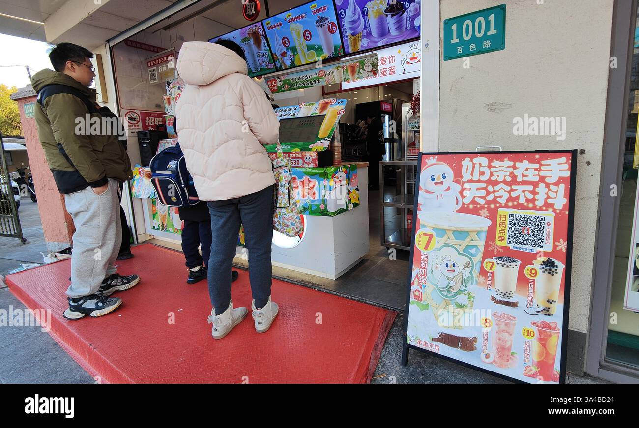 SHANGHAI, CHINA - MARCH 18, 2025 - Customers spend at a MIXUE Ice Cream ...