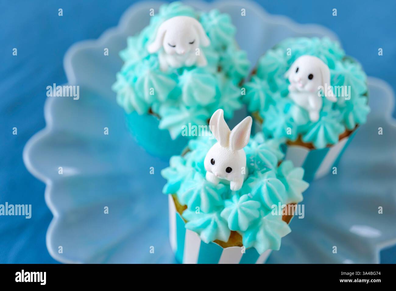 Easter desserts. Cupcake with Blue Frosting and Bunny Topper.Easter ...