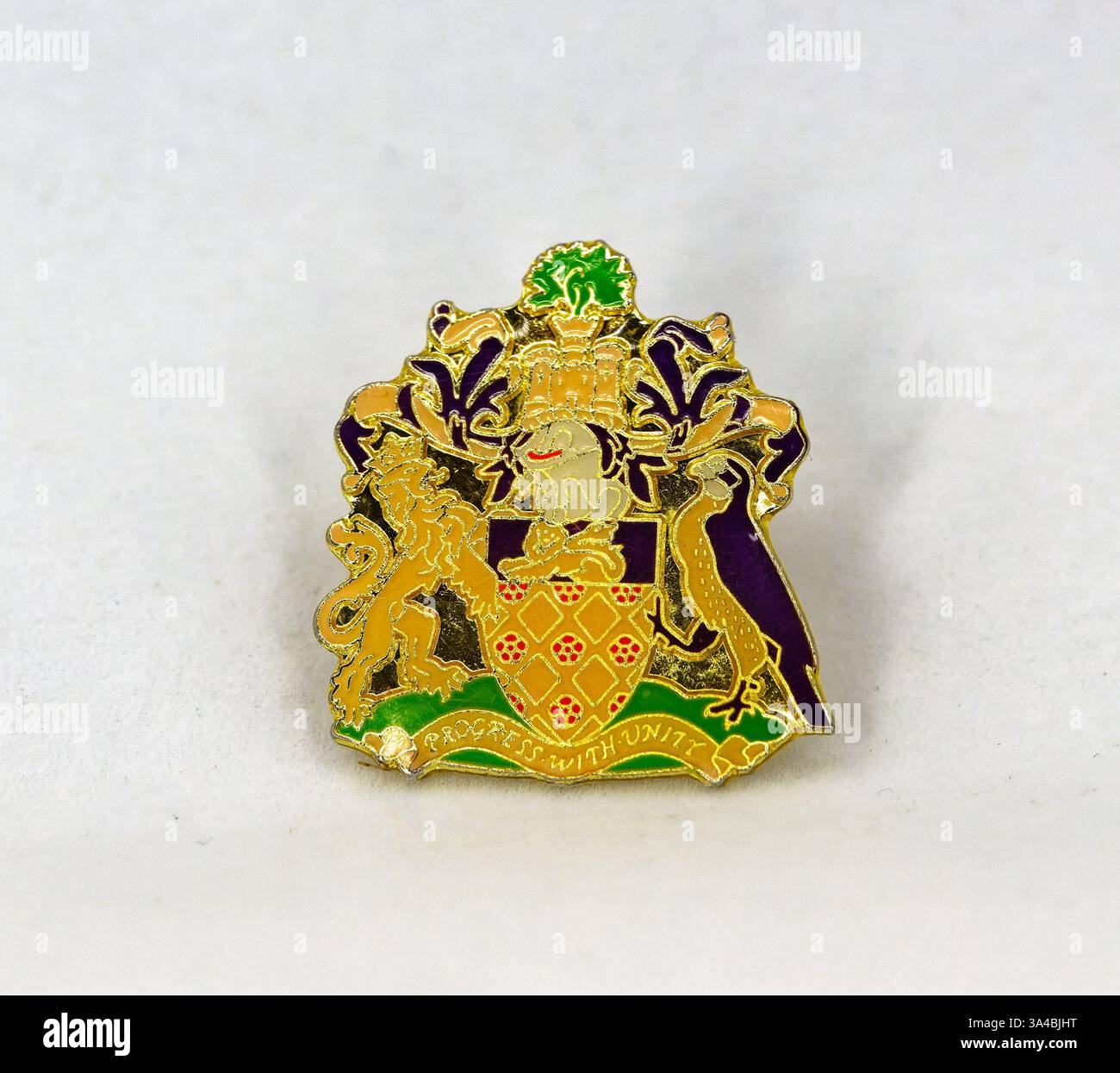 Lapel badge of the Wigan coat of arms and the motto "Progress With ...