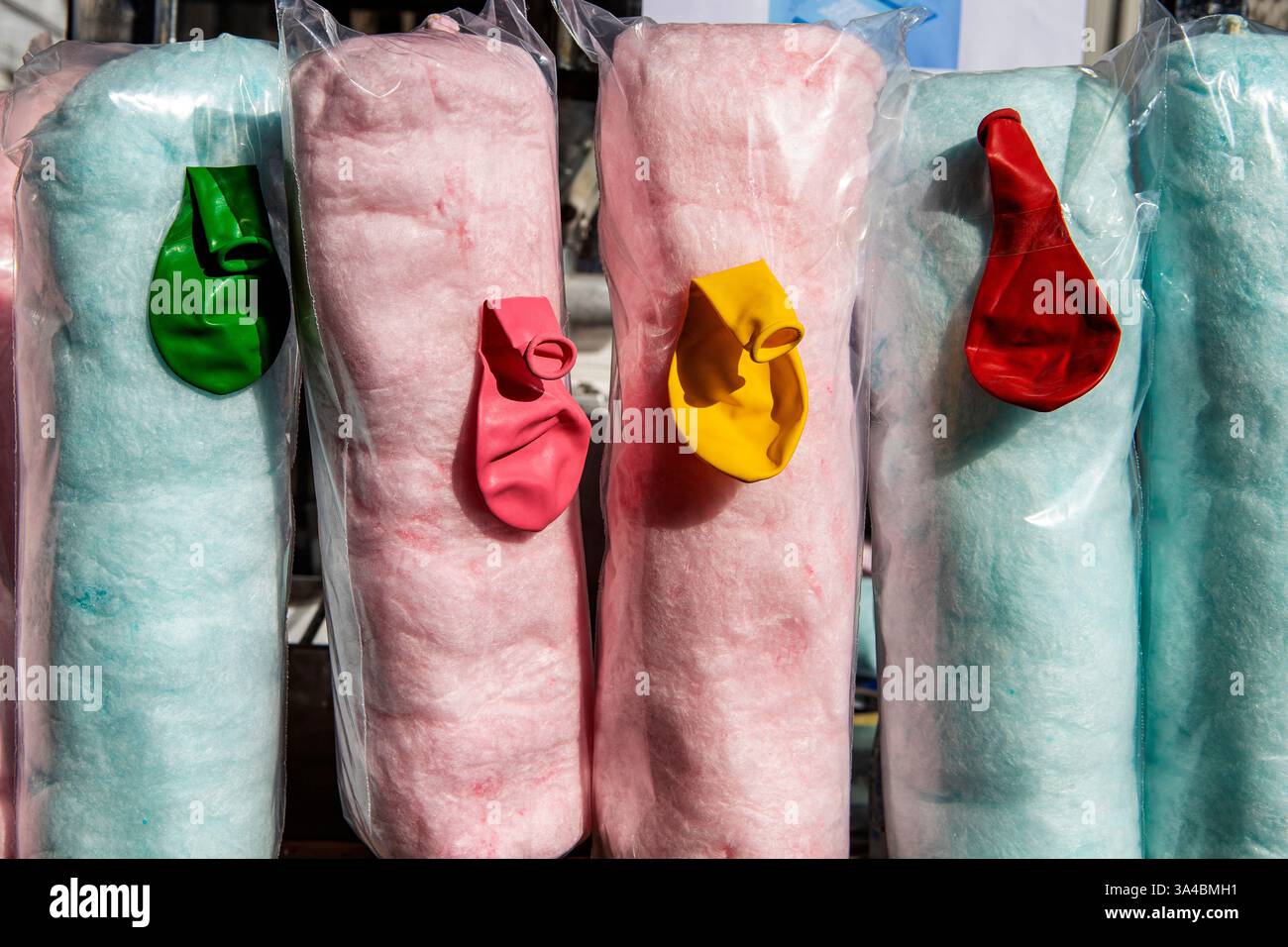 Colorful cotton candy to sale on street market Stock Photo - Alamy