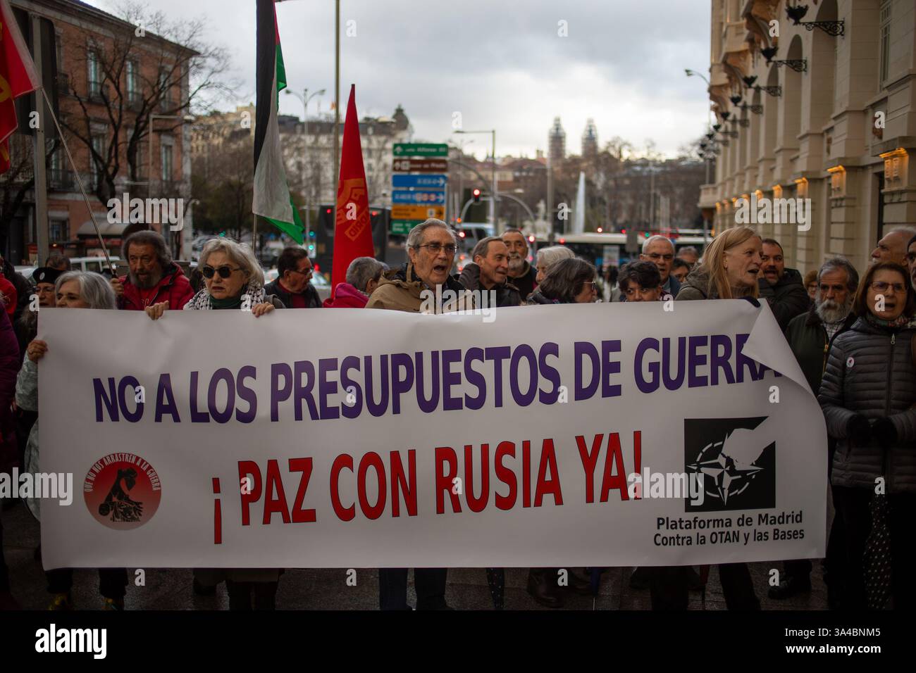 Madrid, Spain. 18th Mar, 2025. Protesters carry a banner with the ...