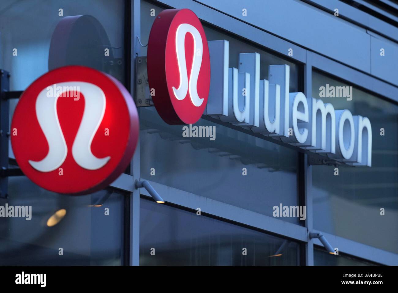 Lululemon signs are displayed outside a retail location in the Seaport ...