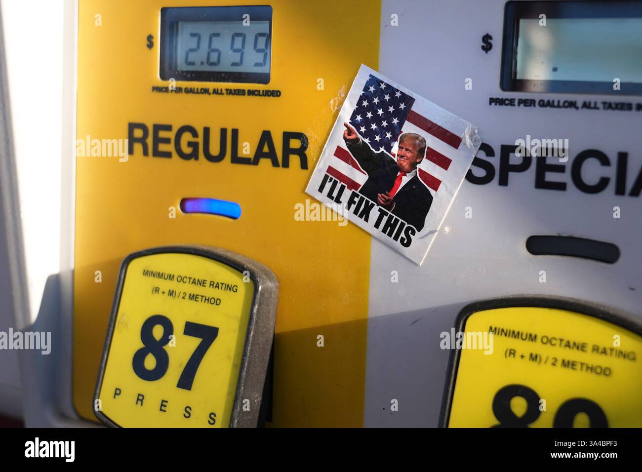 A sticker showing President-elect Donald Trump is displayed on a gas ...