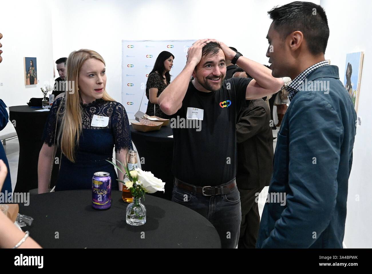 Kalani Leifer, center, founder of Coopcareers, speaks with Kevin Law ...