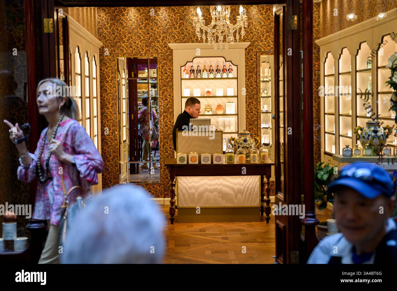 A male retail worker is seen at work in Sydney, New South Wales ...