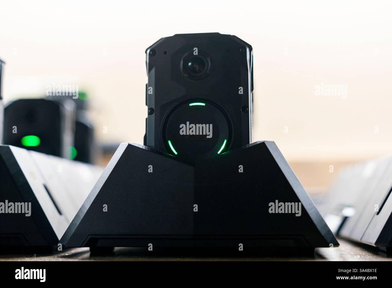 Axon body cameras charge on a docking station at OKCPD headquarters on ...
