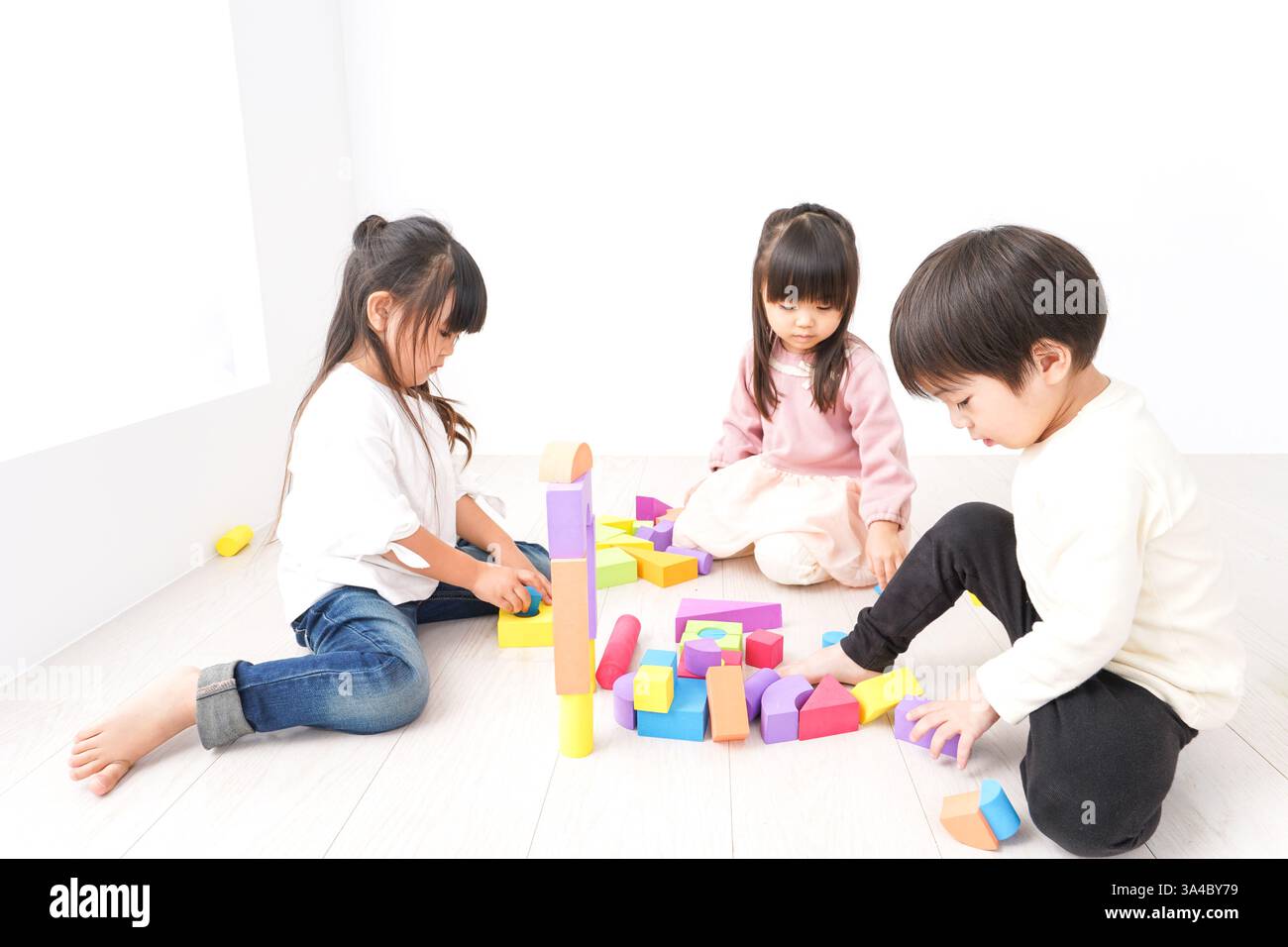 Children playing with blocks Stock Photo - Alamy