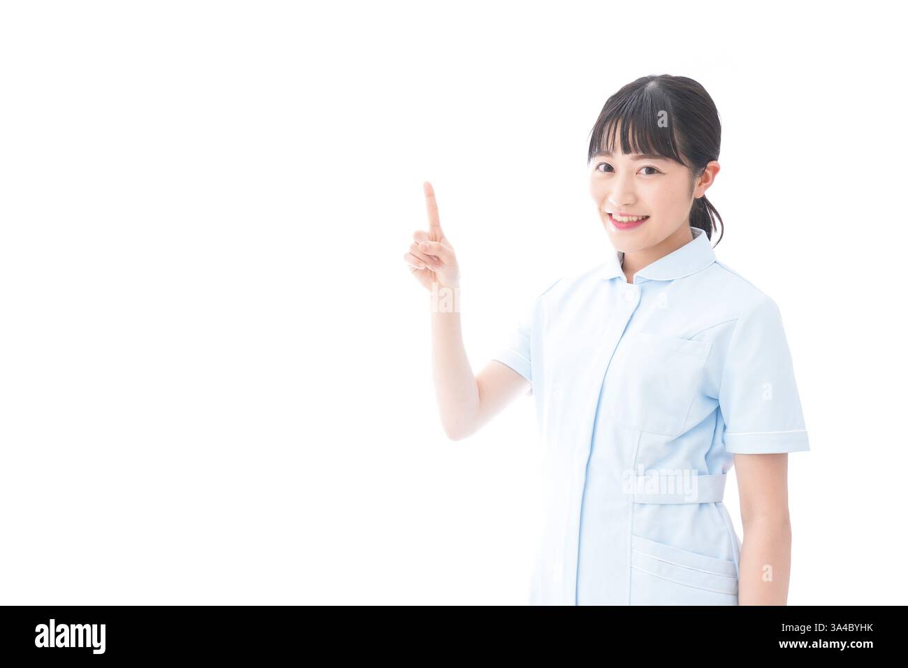 Young nurse pointing finger Stock Photo - Alamy