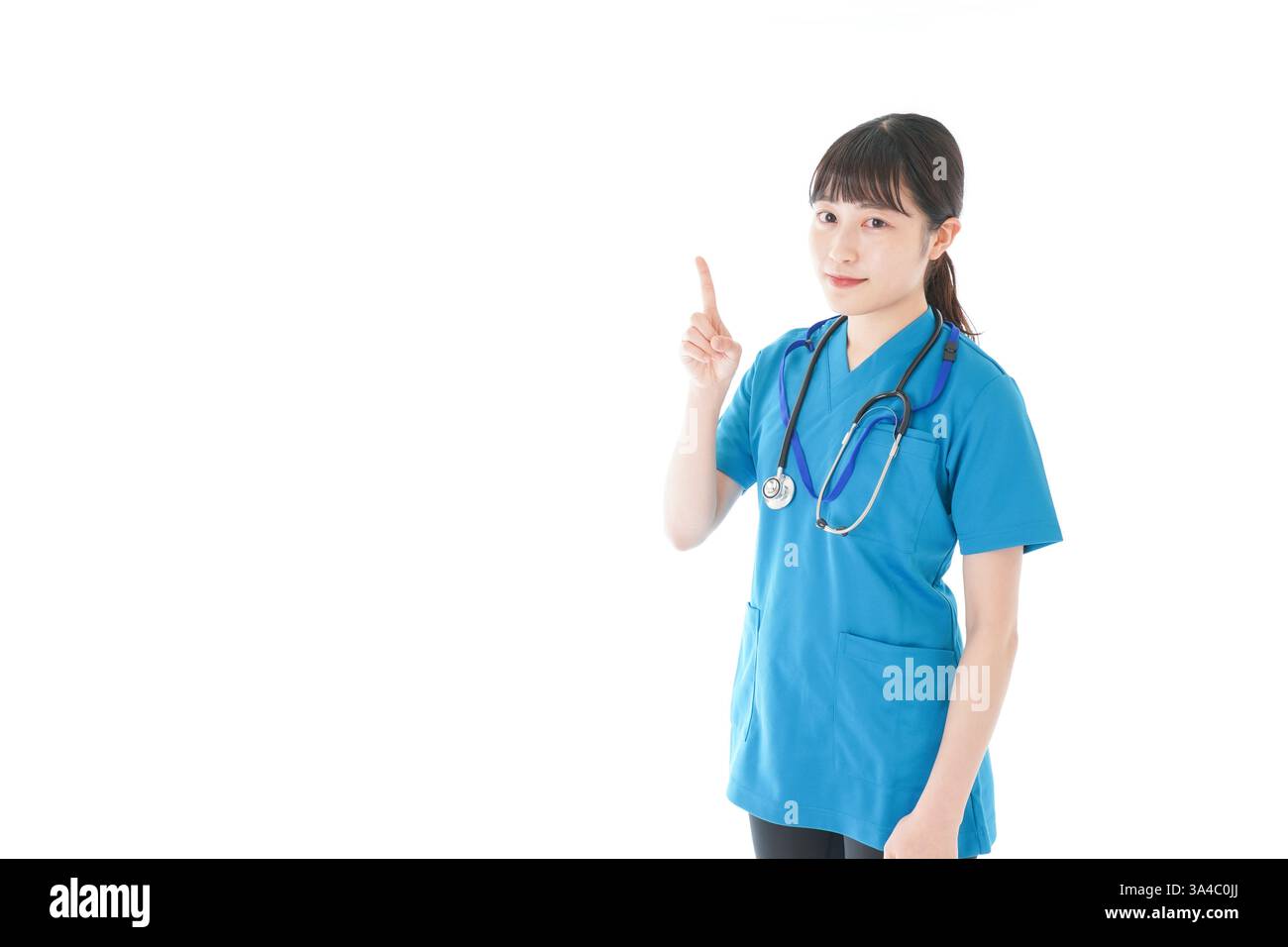 Young female nurse pointing finger Stock Photo - Alamy
