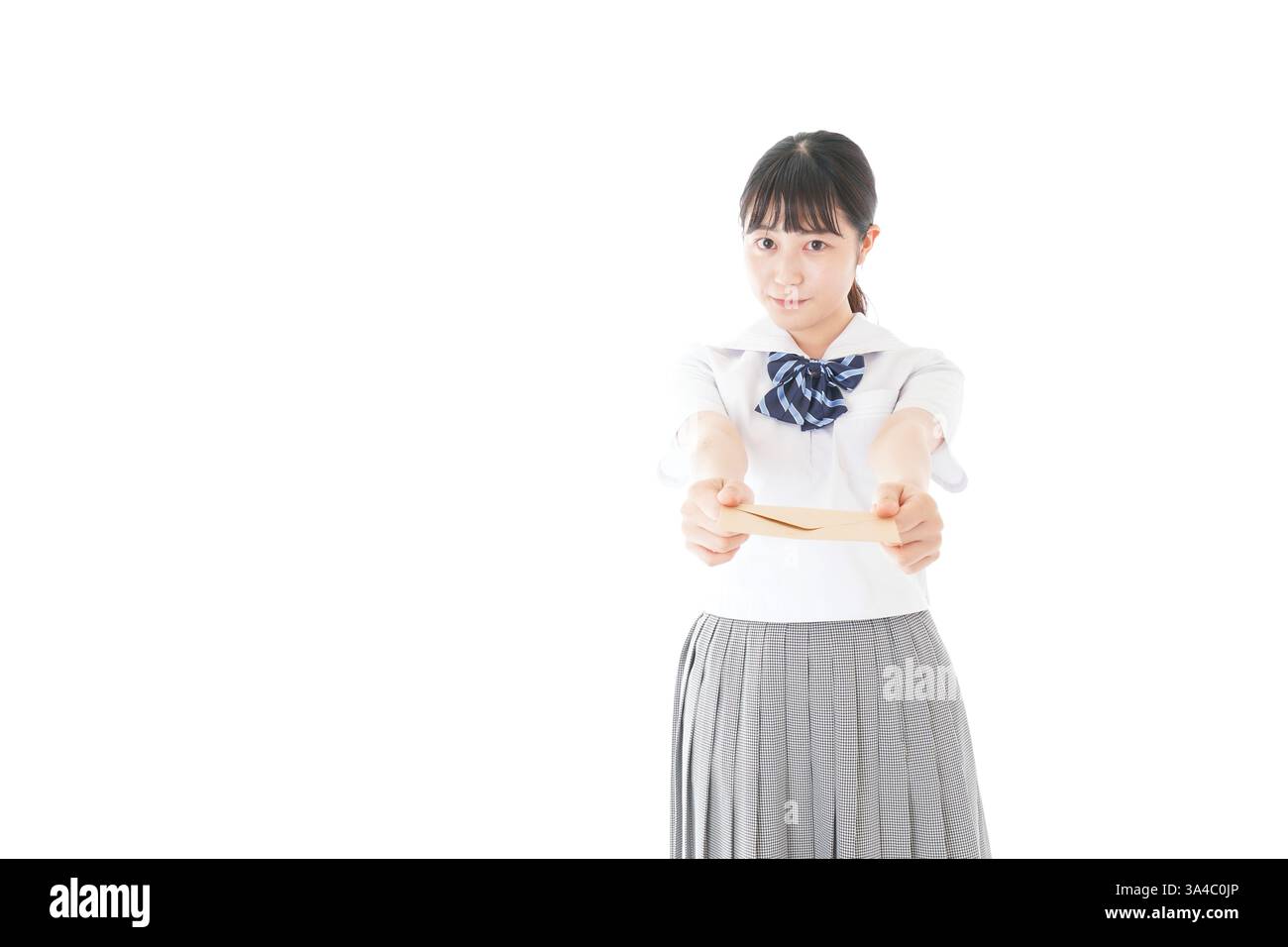 Schoolgirl in school uniform handing out letter Stock Photo - Alamy