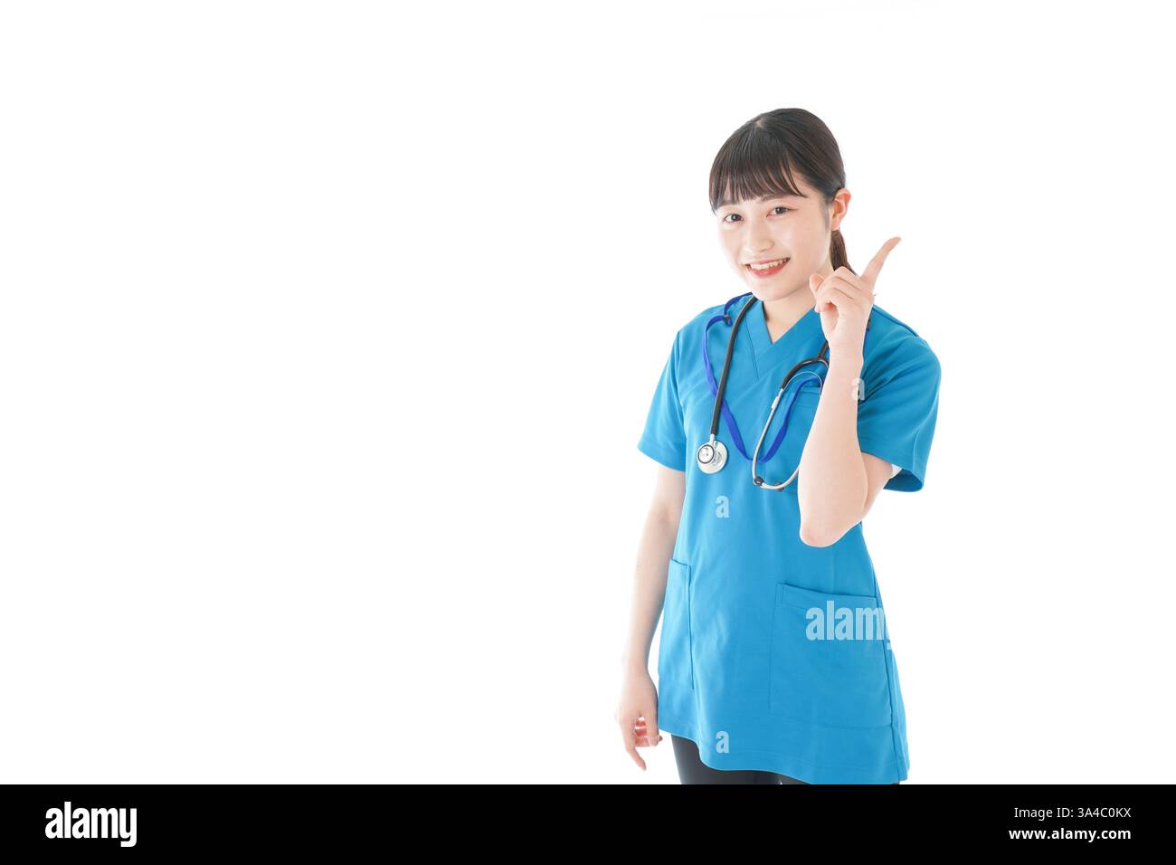 Young female nurse pointing finger Stock Photo - Alamy