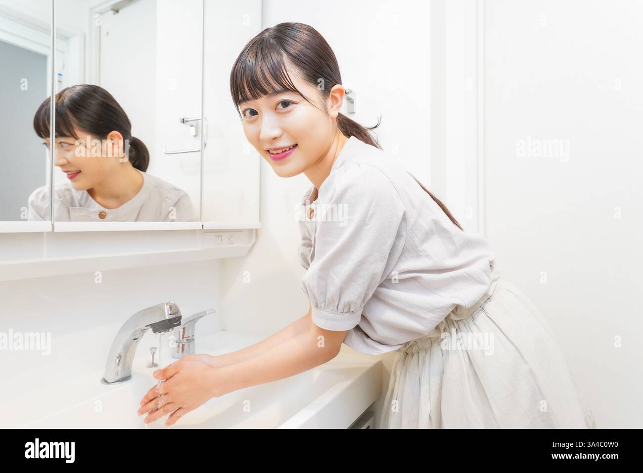 Woman mask washing hands hi-res stock photography and images - Alamy