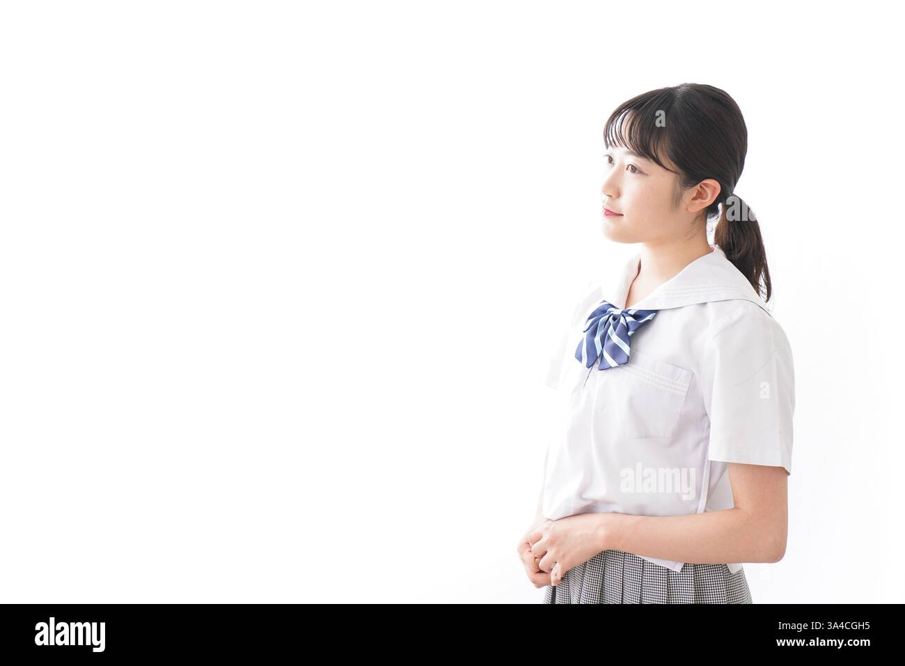 Smiling female high school student in uniform Stock Photo - Alamy