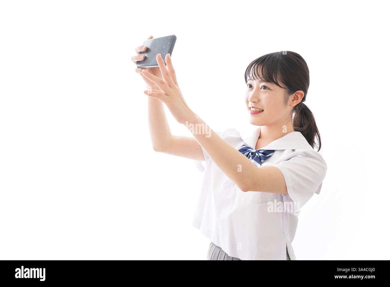 Smiling female high school student in uniform Stock Photo - Alamy