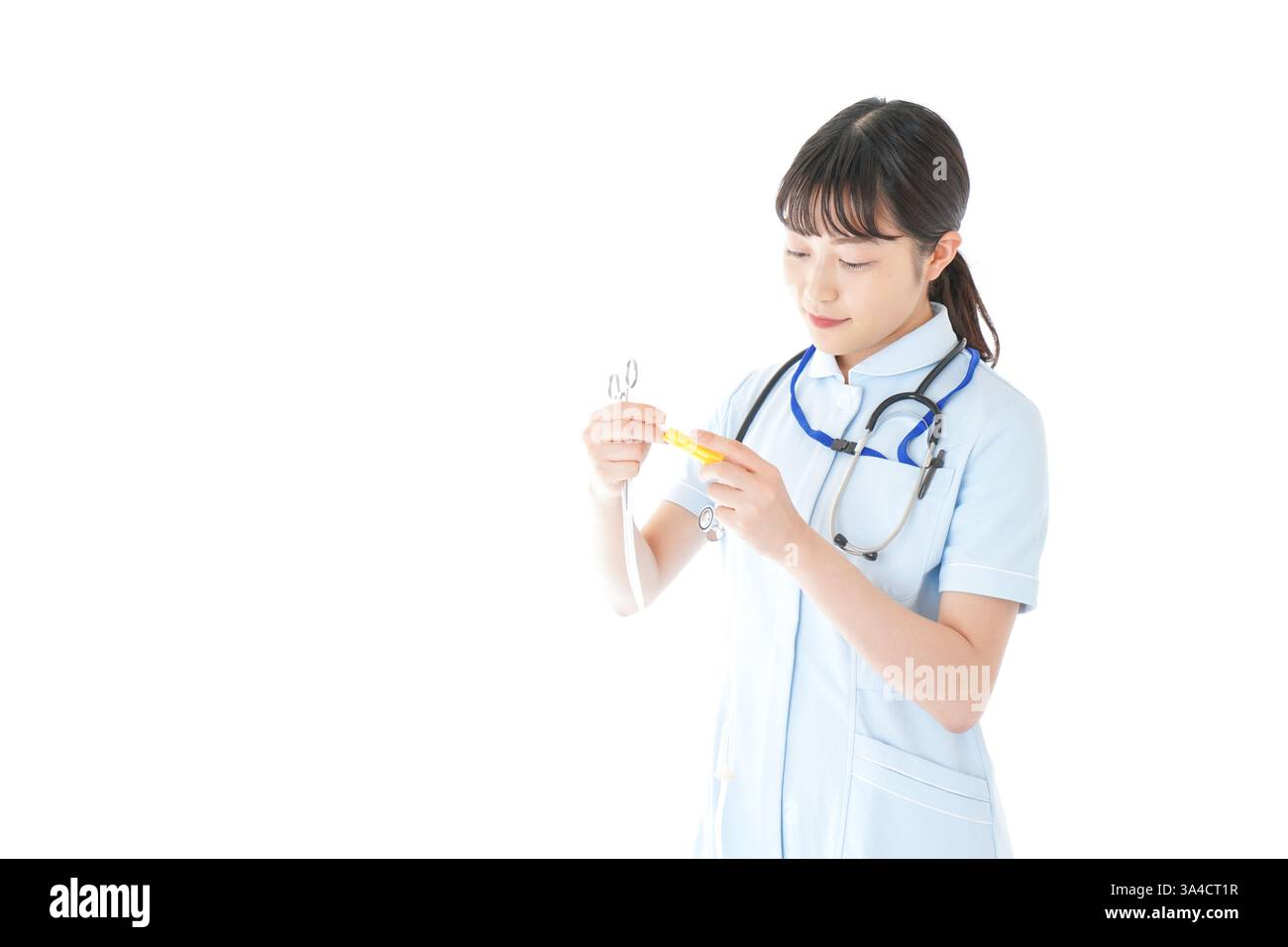 Young nurse using medical equipment Stock Photo - Alamy