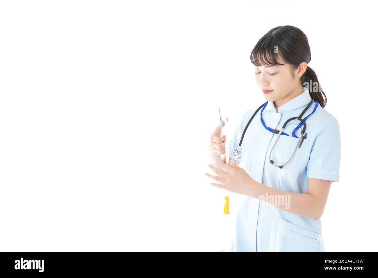 Young nurse using medical equipment Stock Photo - Alamy