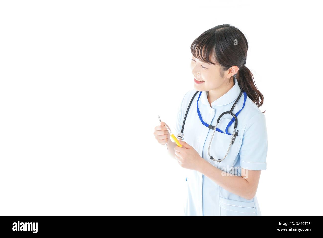 Young nurse using medical equipment Stock Photo - Alamy