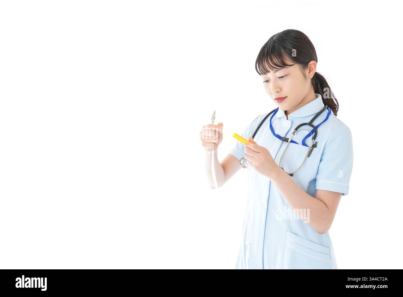 Young nurse using medical equipment Stock Photo - Alamy