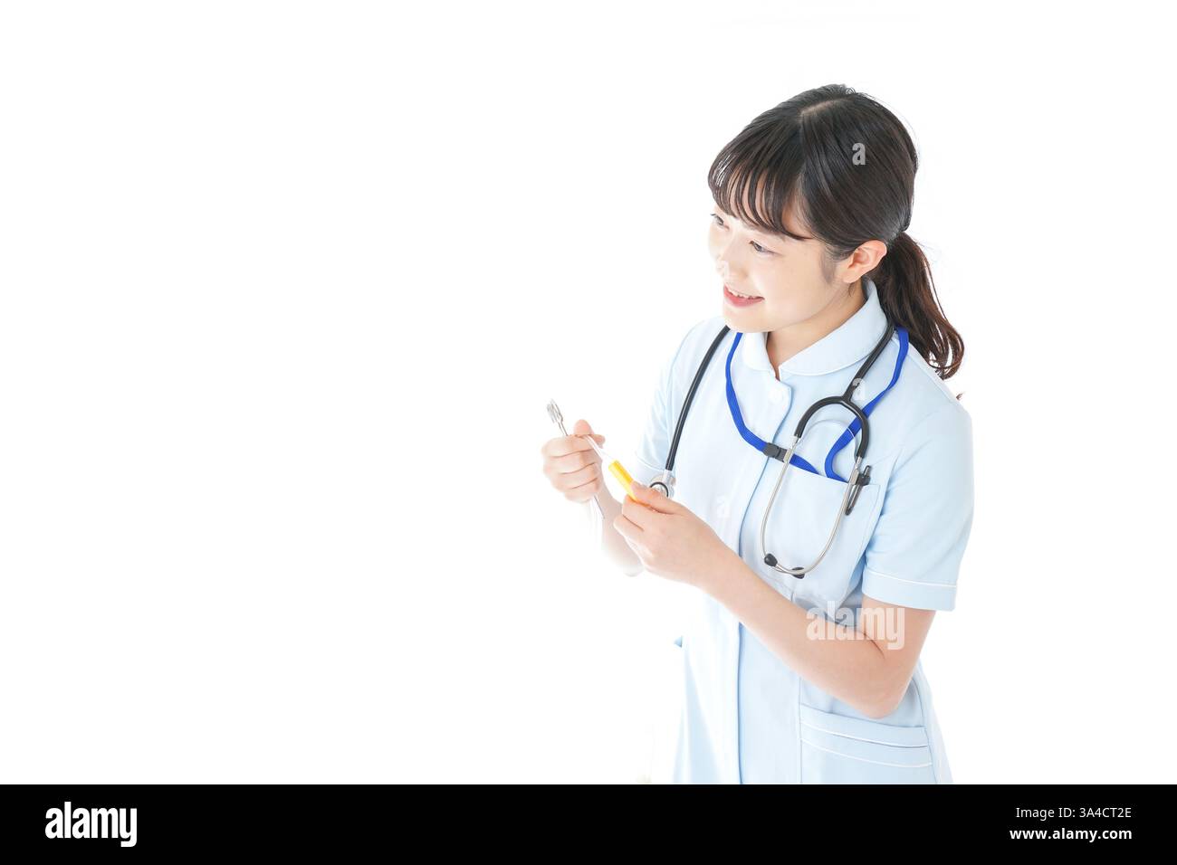 Young nurse using medical equipment Stock Photo - Alamy