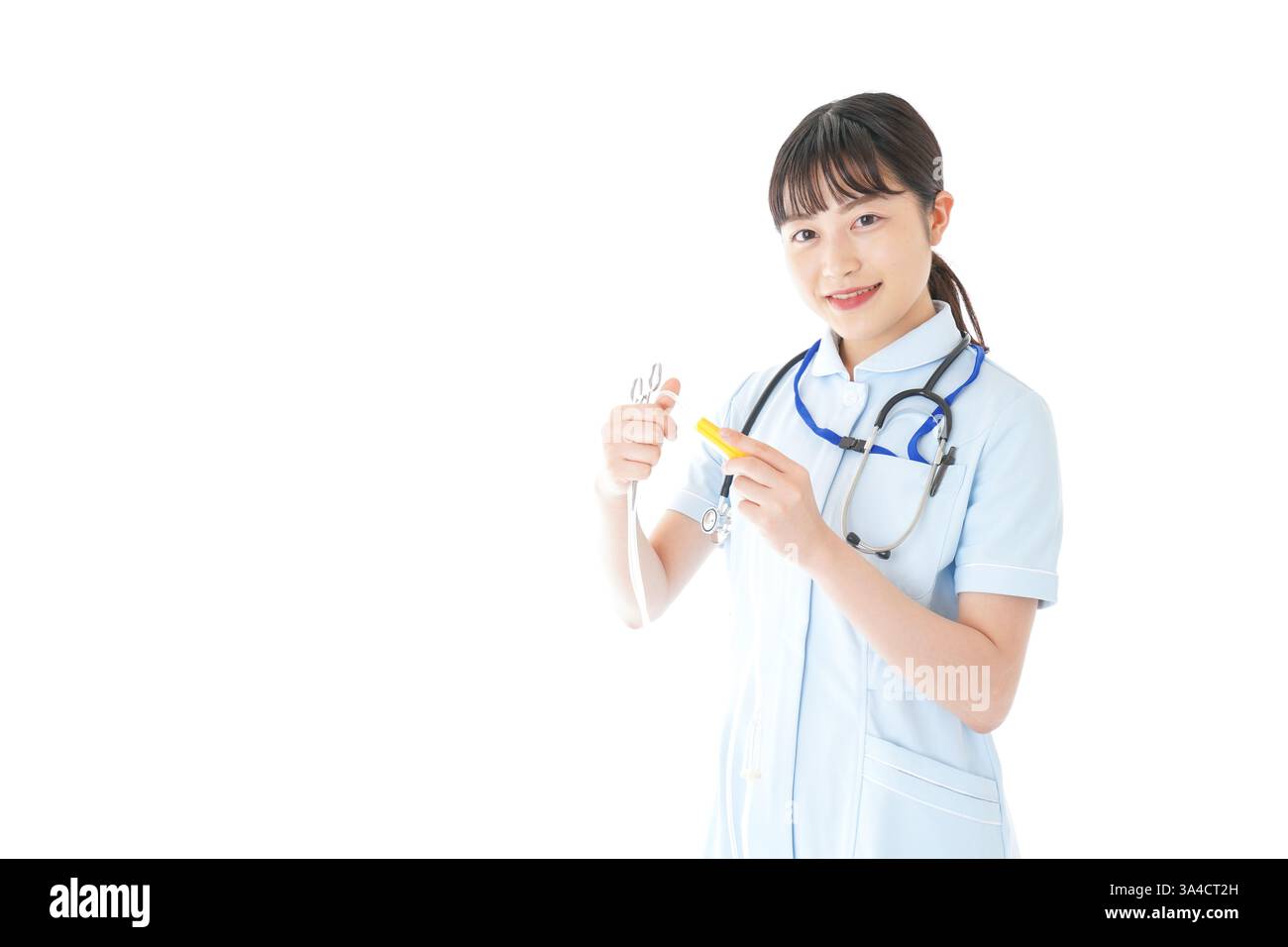 Young nurse using medical equipment Stock Photo - Alamy