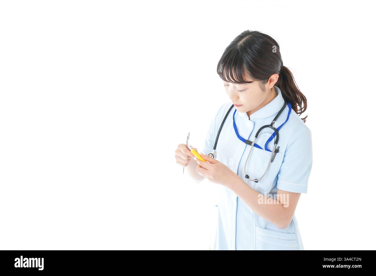 Young nurse using medical equipment Stock Photo - Alamy