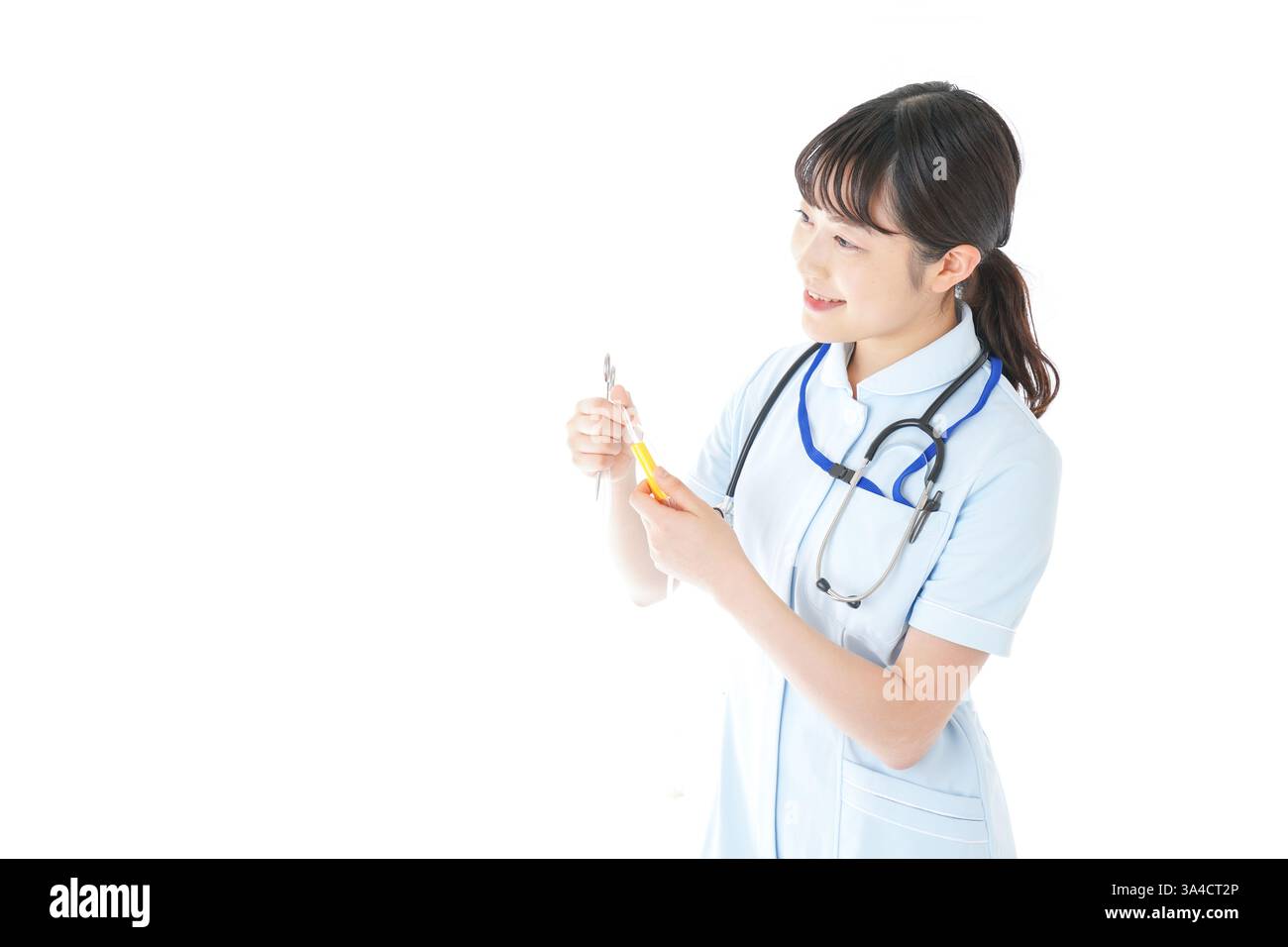 Young nurse using medical equipment Stock Photo - Alamy