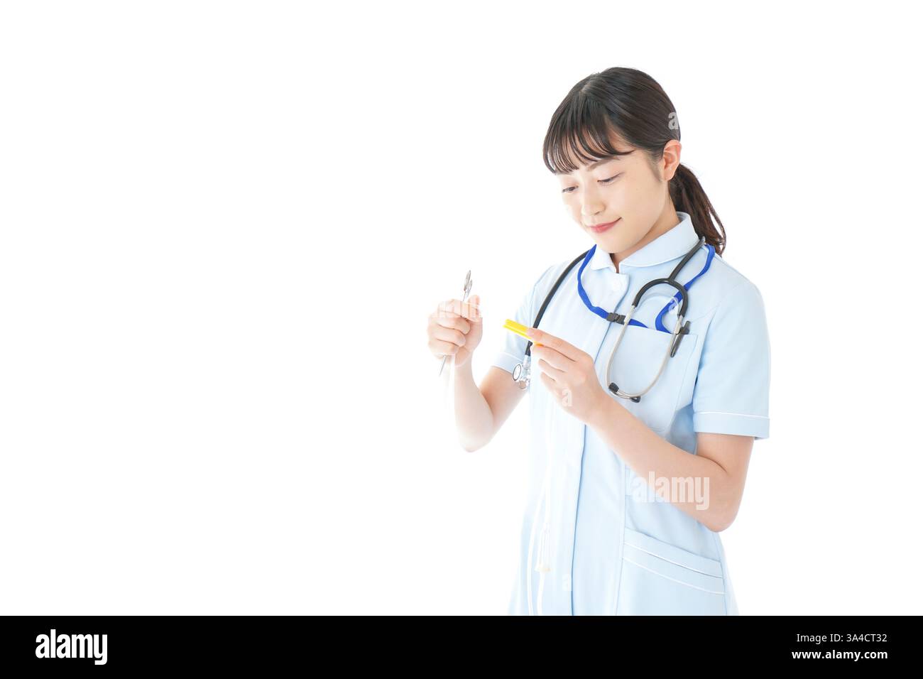 Young nurse using medical equipment Stock Photo - Alamy