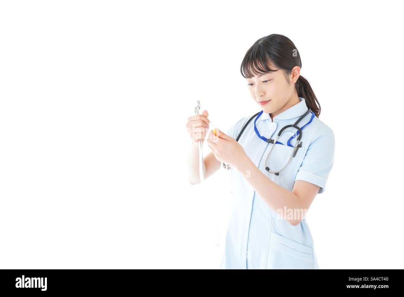 Young nurse using medical equipment Stock Photo - Alamy