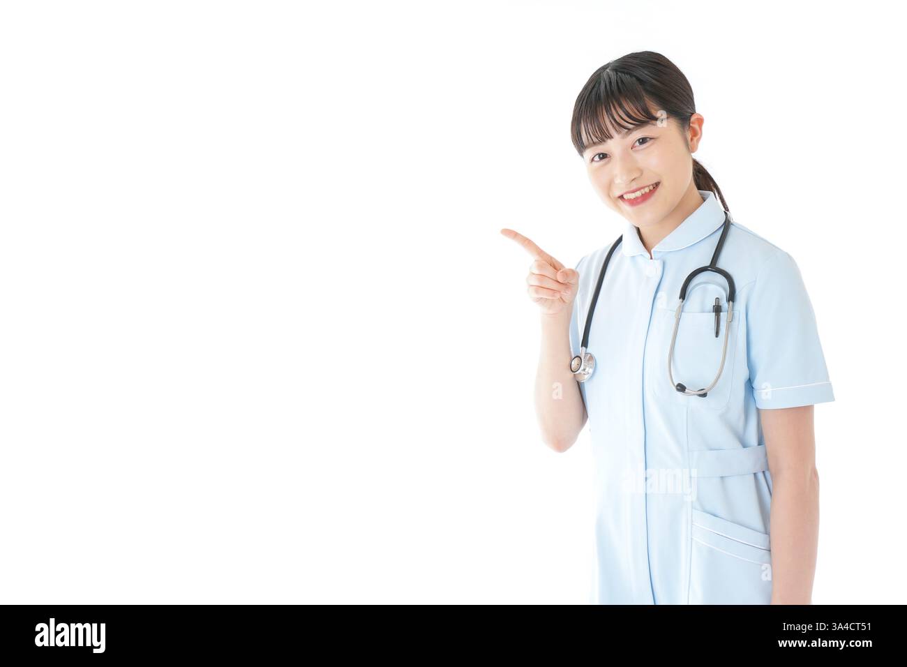 Young nurse pointing to point Stock Photo - Alamy