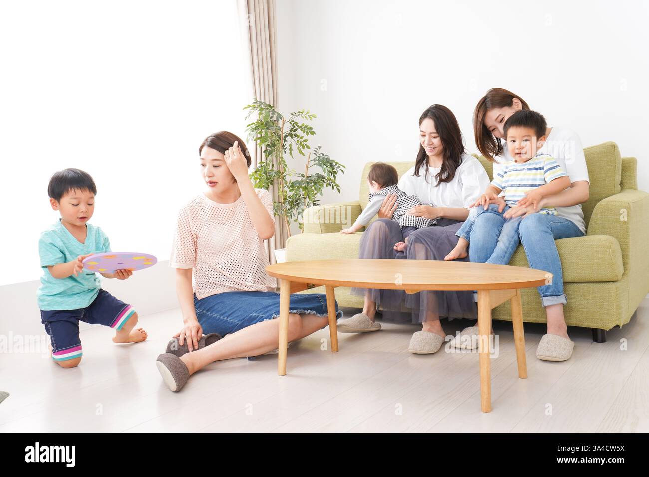 Child and mother playing happily indoors Stock Photo - Alamy