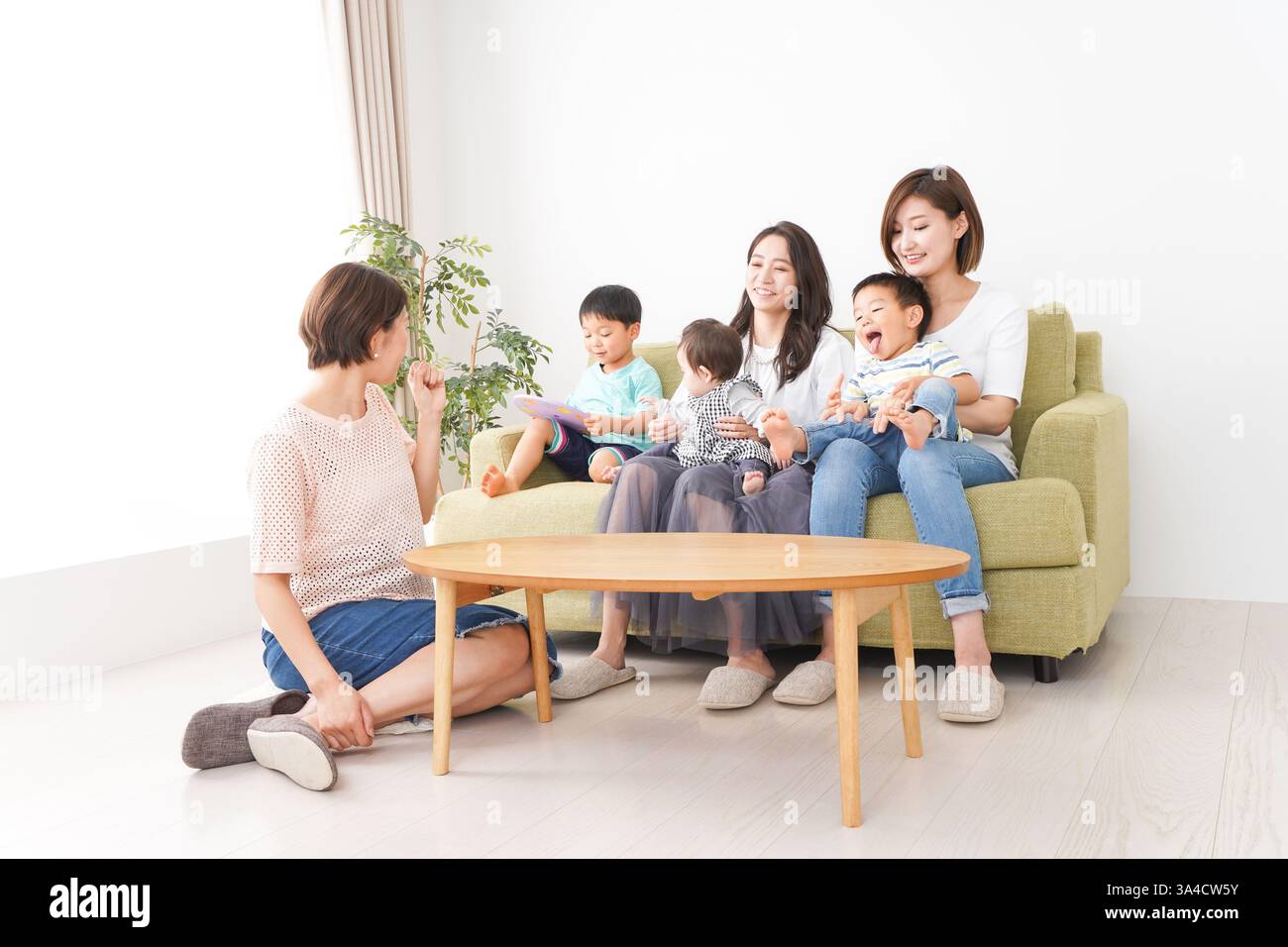 Child and mother playing happily indoors Stock Photo - Alamy