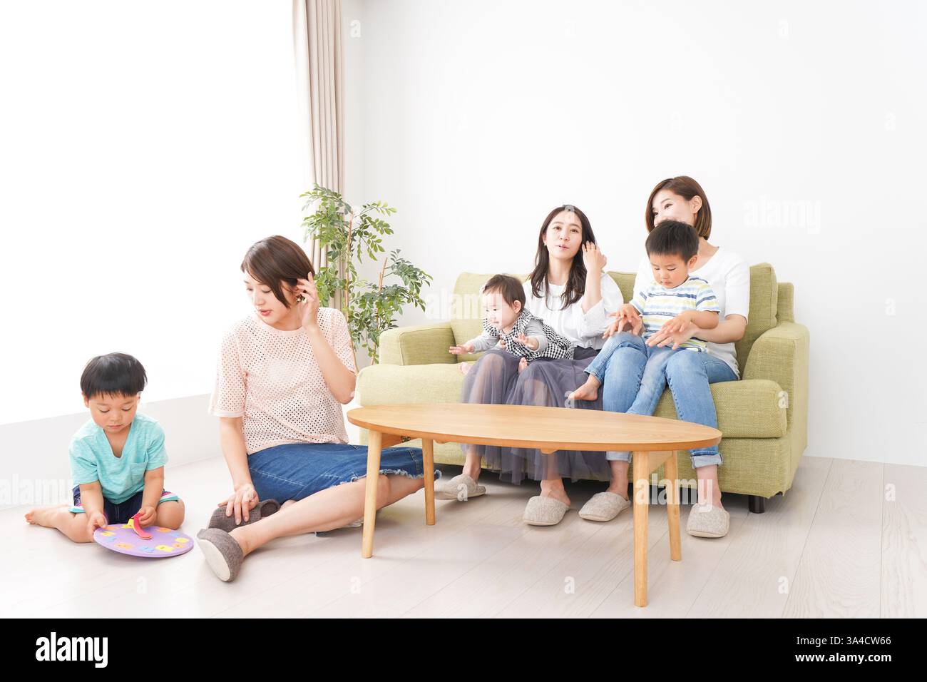 Child and mother playing happily indoors Stock Photo - Alamy