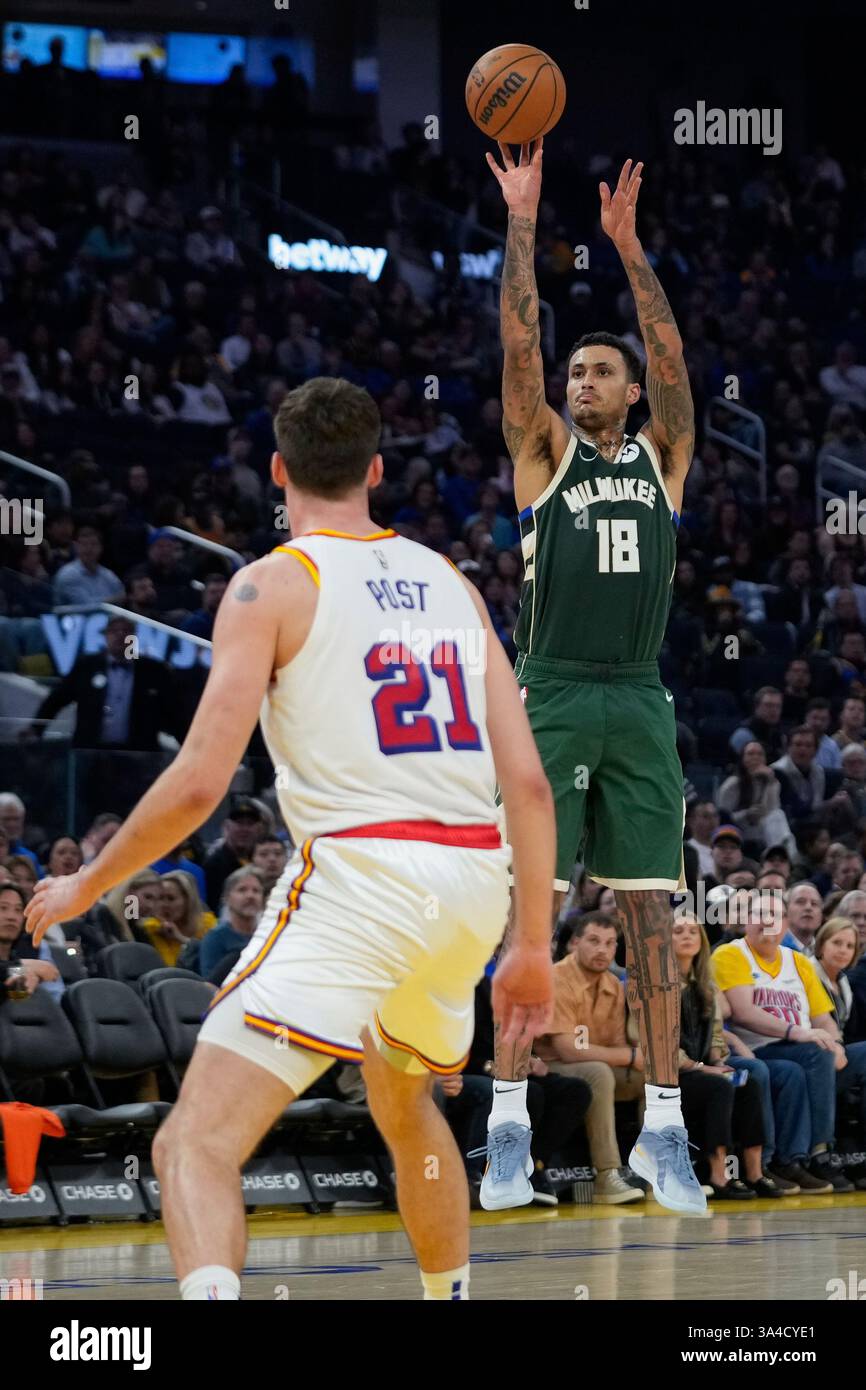 Milwaukee Bucks forward Kyle Kuzma (18) shoots a 3-point basket in ...