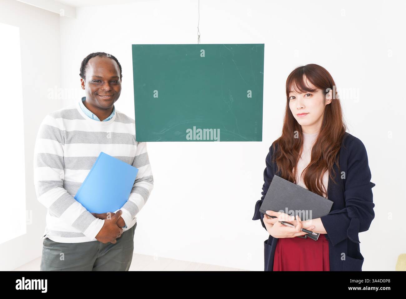 Woman taking a class from a native teacher Stock Photo - Alamy