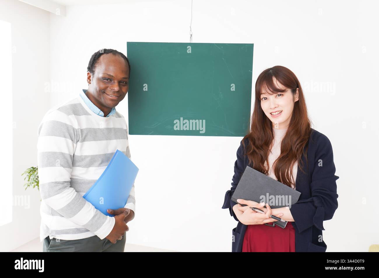 Woman taking a class from a native teacher Stock Photo - Alamy
