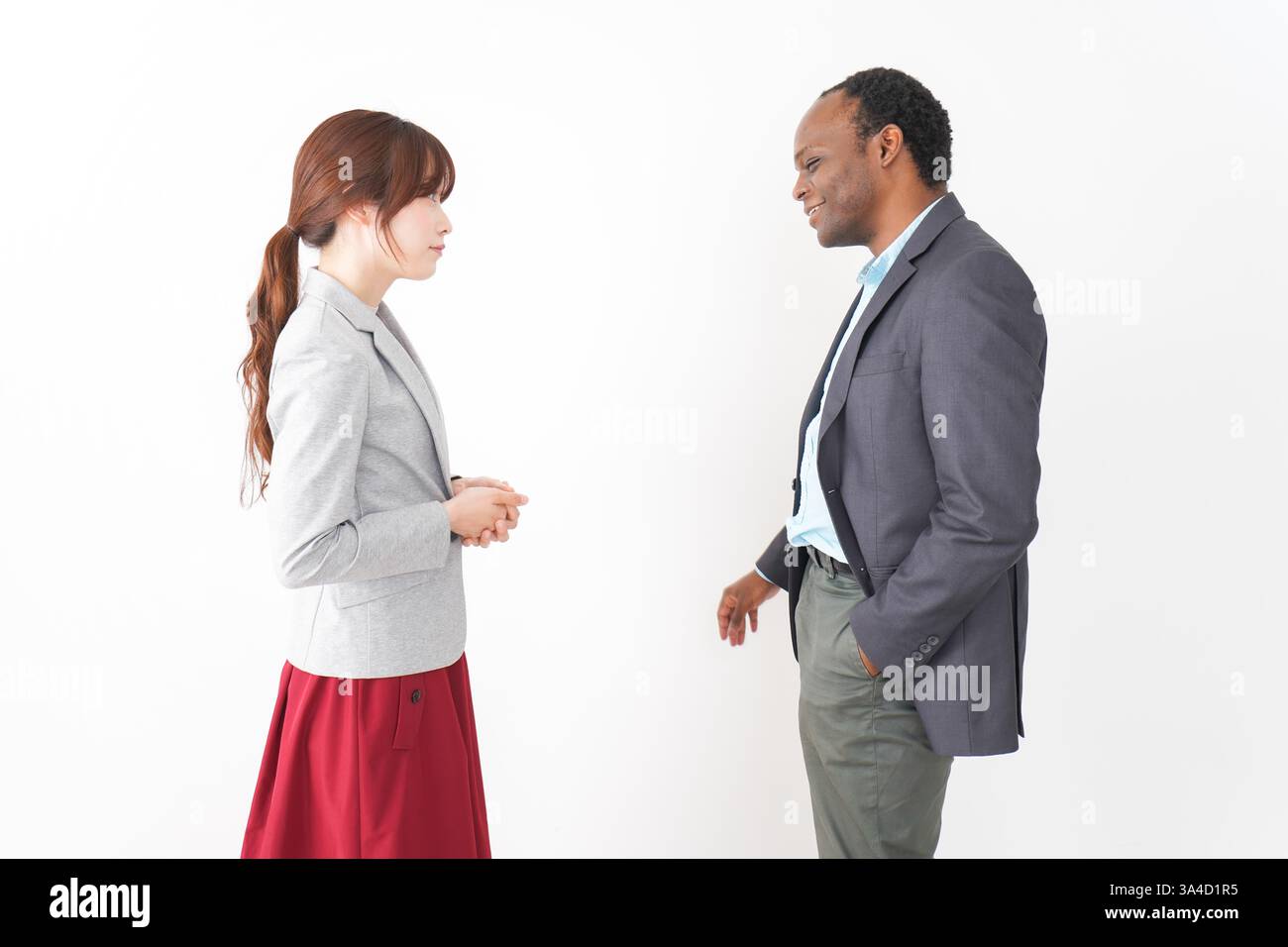 Two business people exchanging views in an office Stock Photo - Alamy