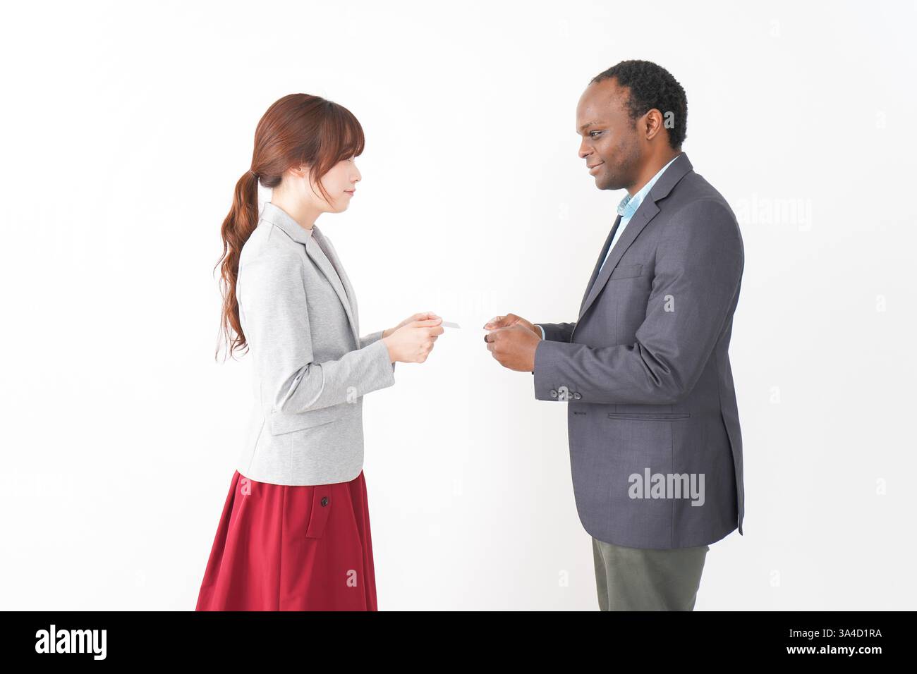 Two business people exchanging business cards Stock Photo - Alamy