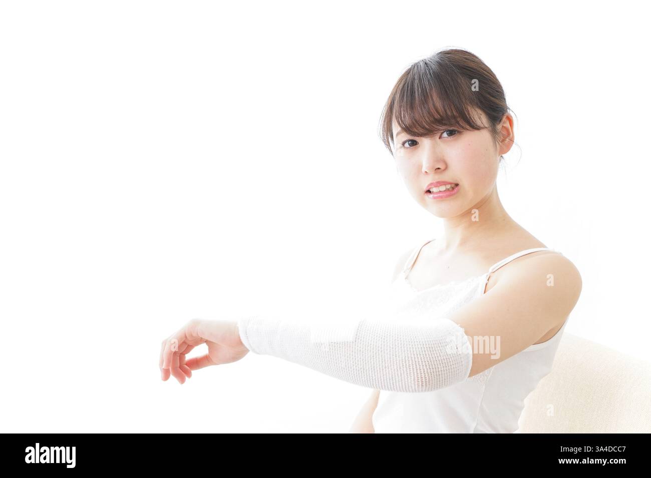 Woman with arm injury Stock Photo - Alamy