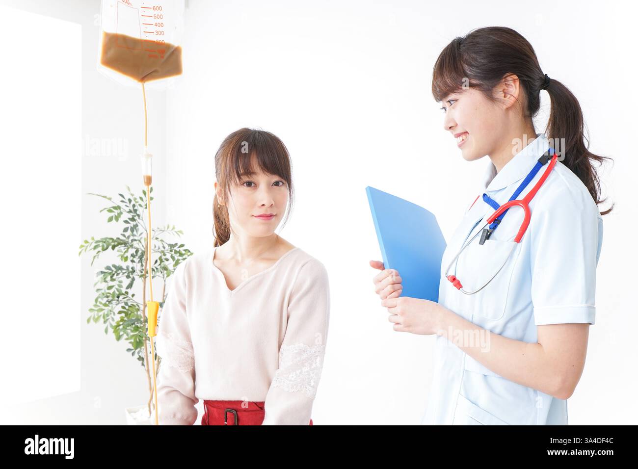 Woman being treated illness hi-res stock photography and images - Alamy