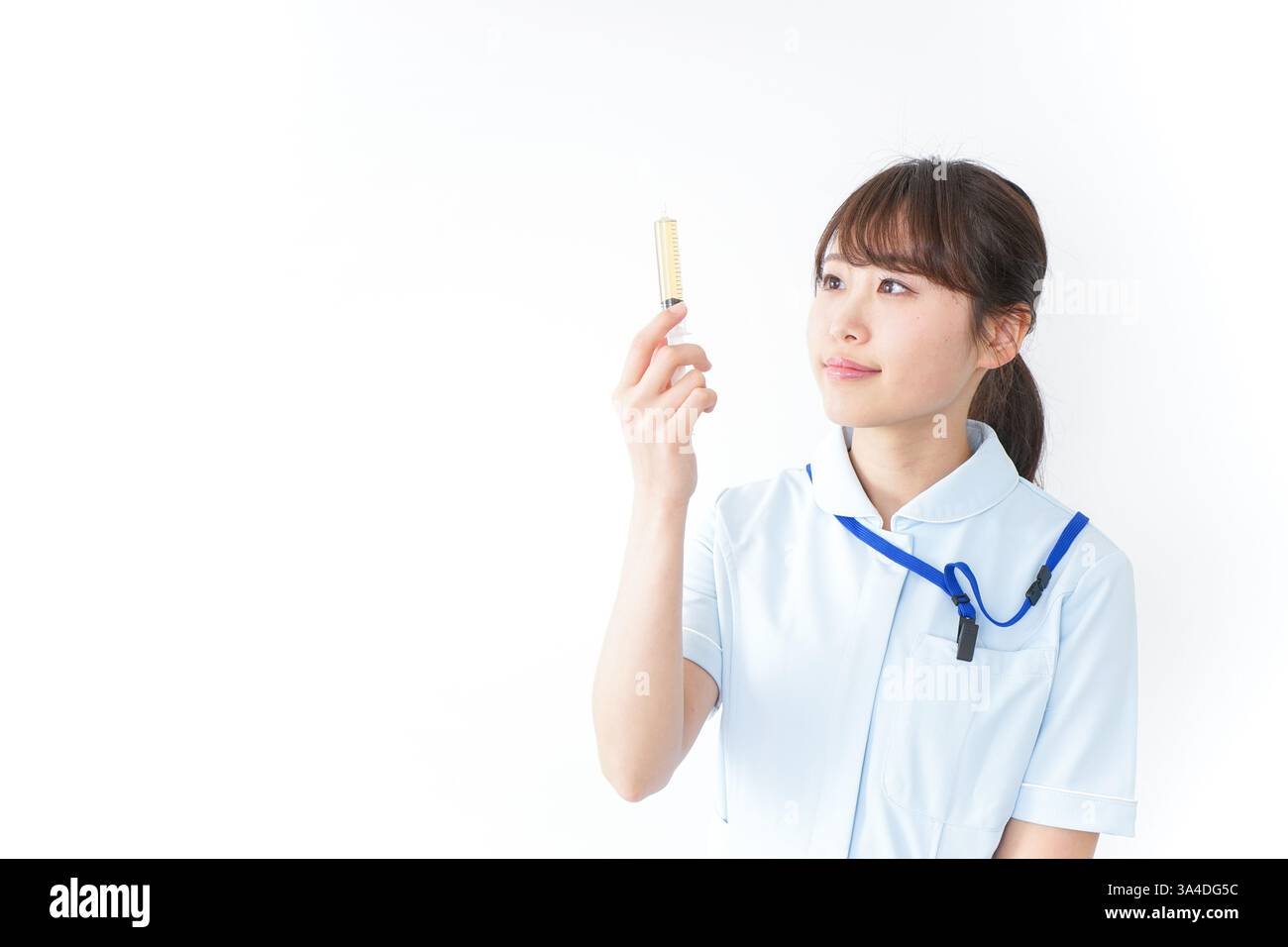 Nurse holding syringe Stock Photo - Alamy