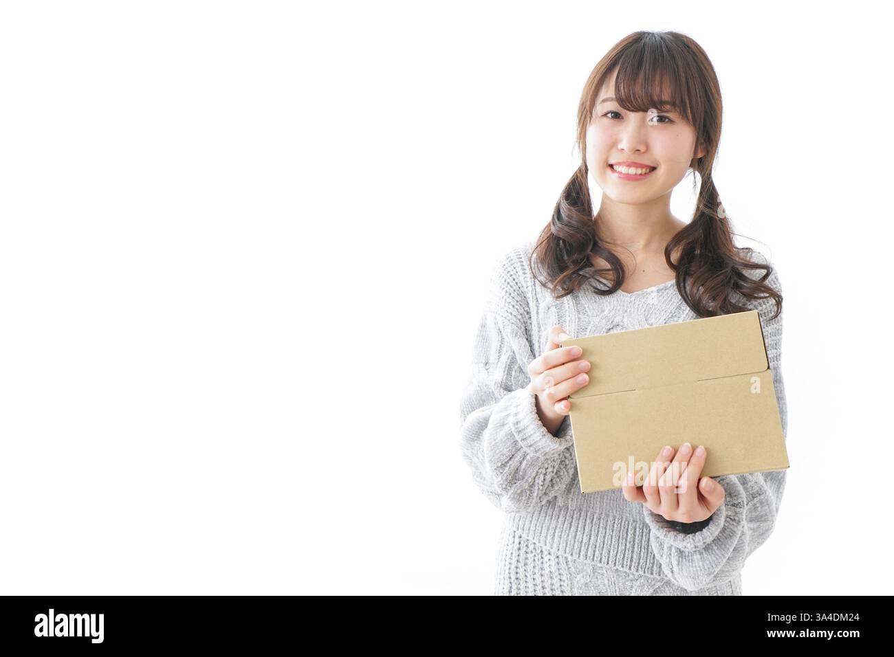 Woman receiving a parcel delivery Stock Photo - Alamy