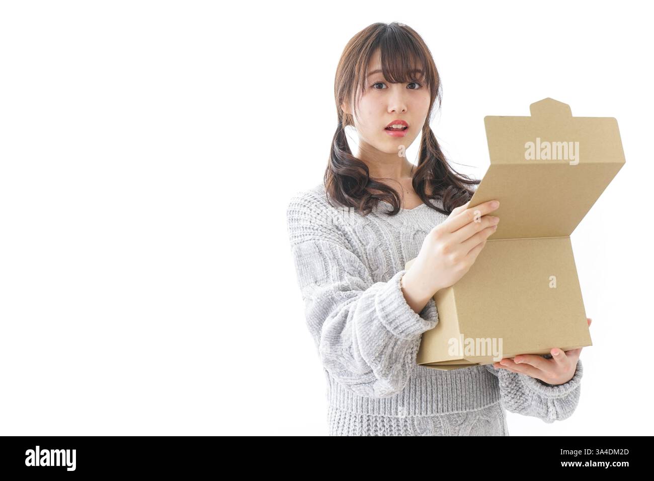 Woman receiving parcel delivery Cut Out Stock Images & Pictures - Alamy