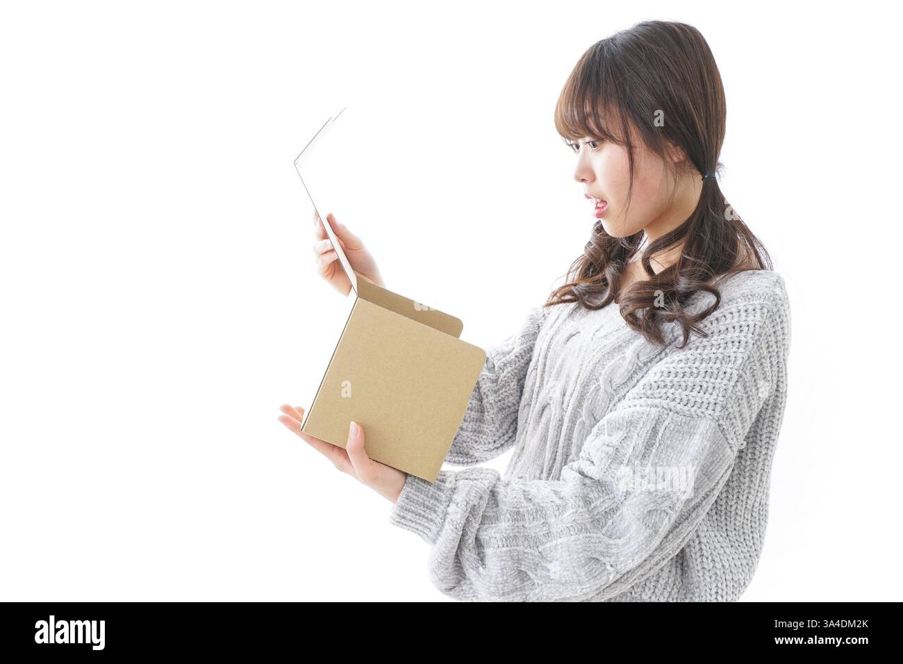 Woman receiving a parcel delivery Stock Photo - Alamy