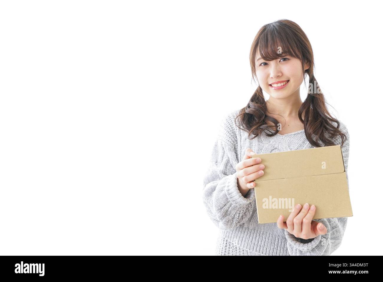 Woman receiving a parcel delivery Stock Photo - Alamy