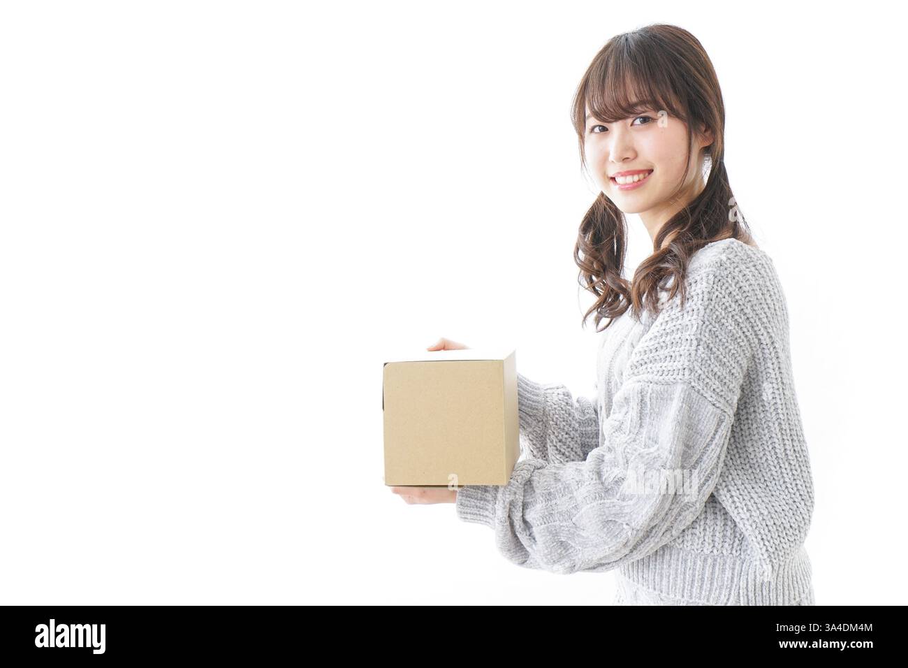 Woman receiving a parcel delivery Stock Photo - Alamy