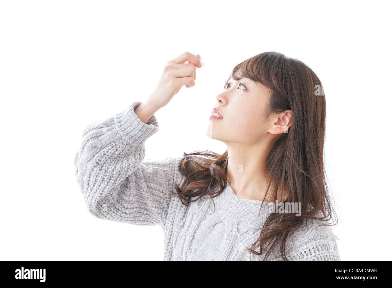 Woman Applying Eye Drops Stock Photo Alamy
