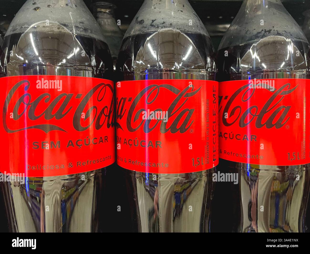 Three Coca Cola bottles, on the shelf in a grocery store in Sao Paulo, Brazil. March 14, 2025 ...