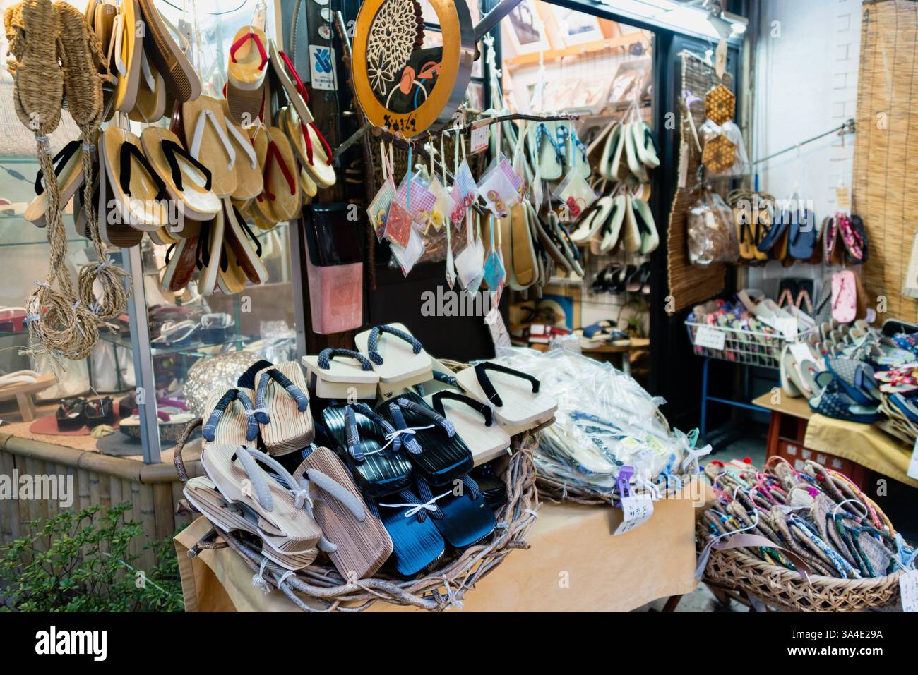 Photo shows an traditional store selling sandals and other footwear in ...