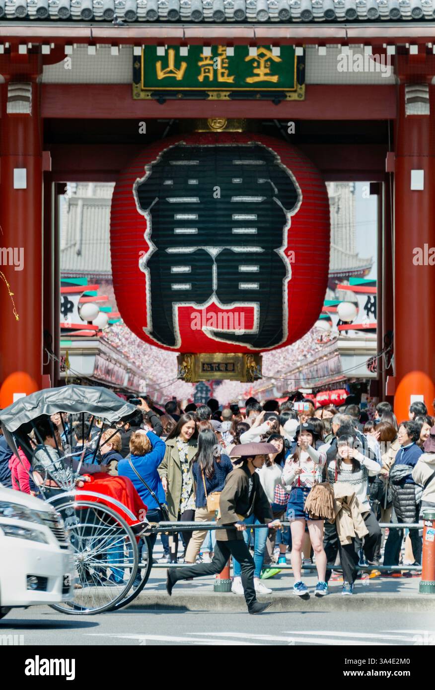 Tokyo Sky Tree in the distance, a Jin-Rikisha driver passes the ...
